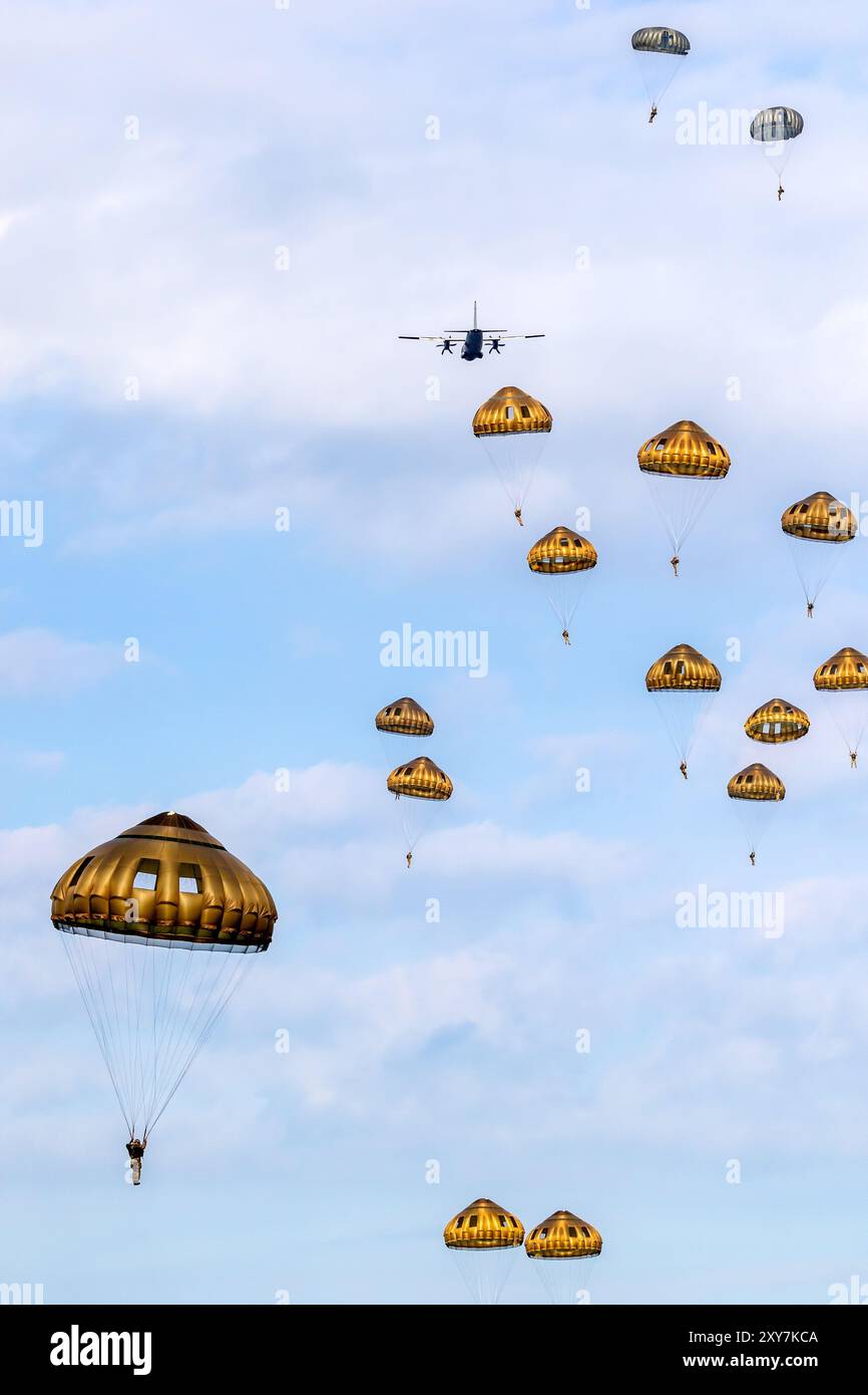 NATO military parachutist paratroopers parachute jumping out of a ...