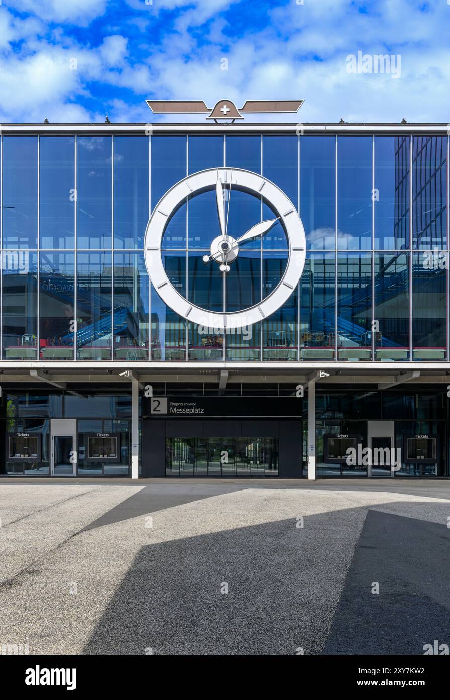 Entrance to building 2 of Messeplatz Basel showing the gigantic clock ...
