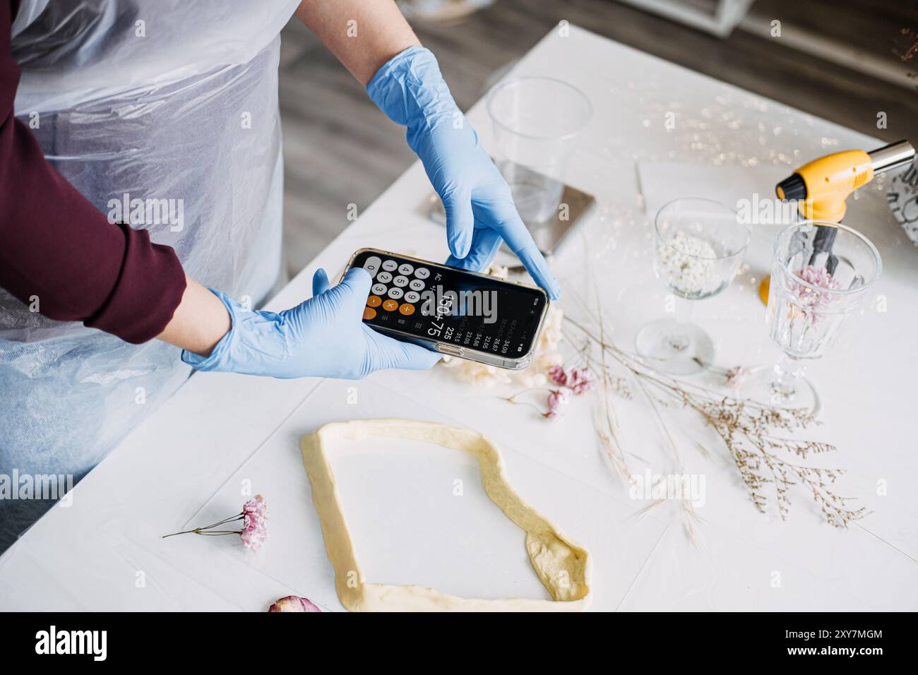 Crafting process with precise measurements, artisan calculating resin ...