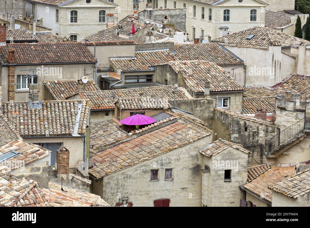 Above the tiled roofs of the small town of Uzes in the south of France ...