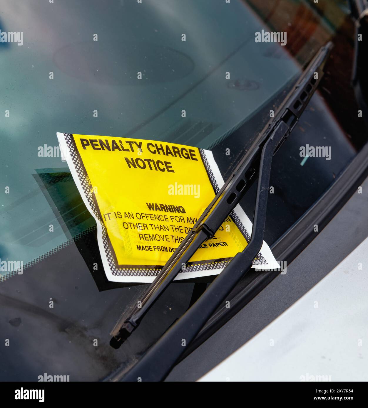 A penalty notice charge ticket on the window screen of a car Stock ...