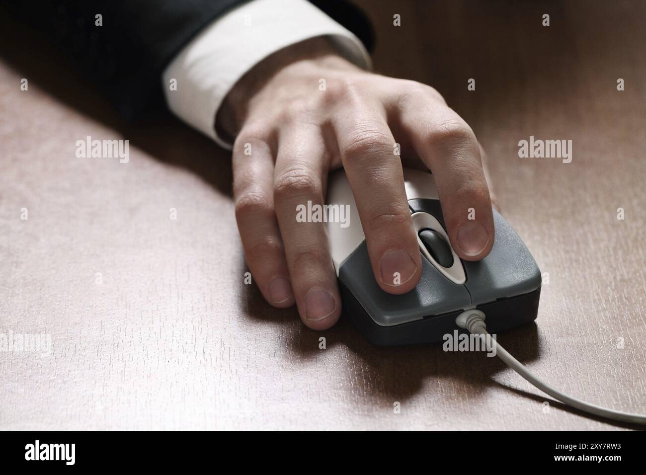 Image of a computer mouse in hand businessman Stock Photo - Alamy