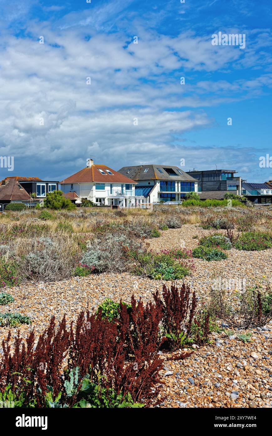 Exclusive houses on the foreshore at Shoreham beach on a hot sunny ...