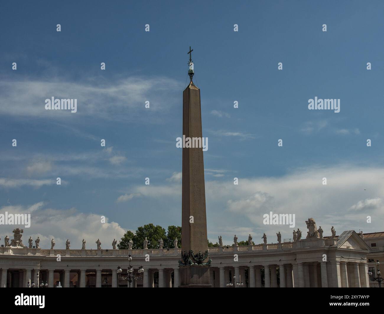 Historic obelisk in the centre of a square, surrounded by columns and ...