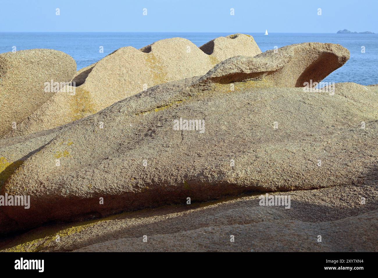 Rocks, sea, boat, bizzare shapes Stock Photo - Alamy
