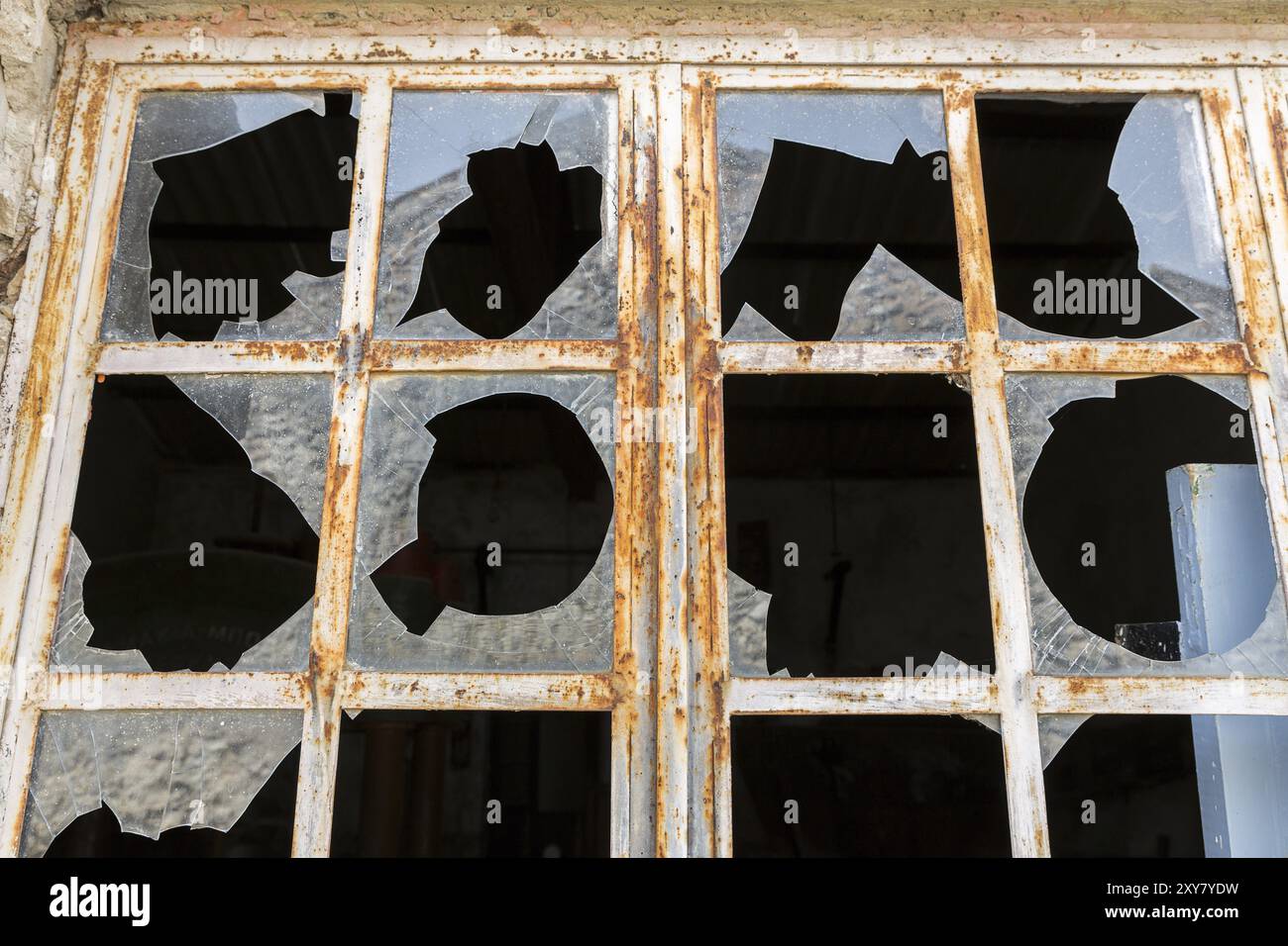 Broken window panes in the metal frame Stock Photo - Alamy