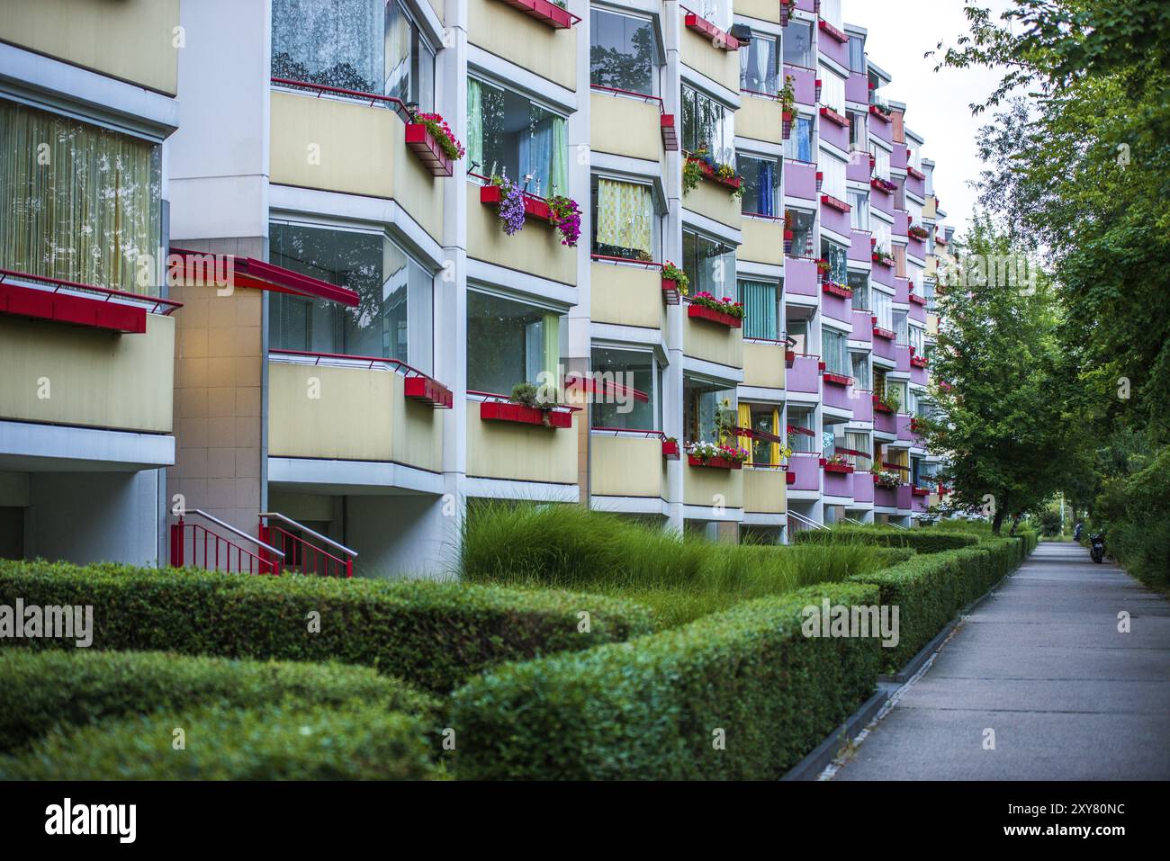 Pink and yellow facade of an apartment block, also known as a ...