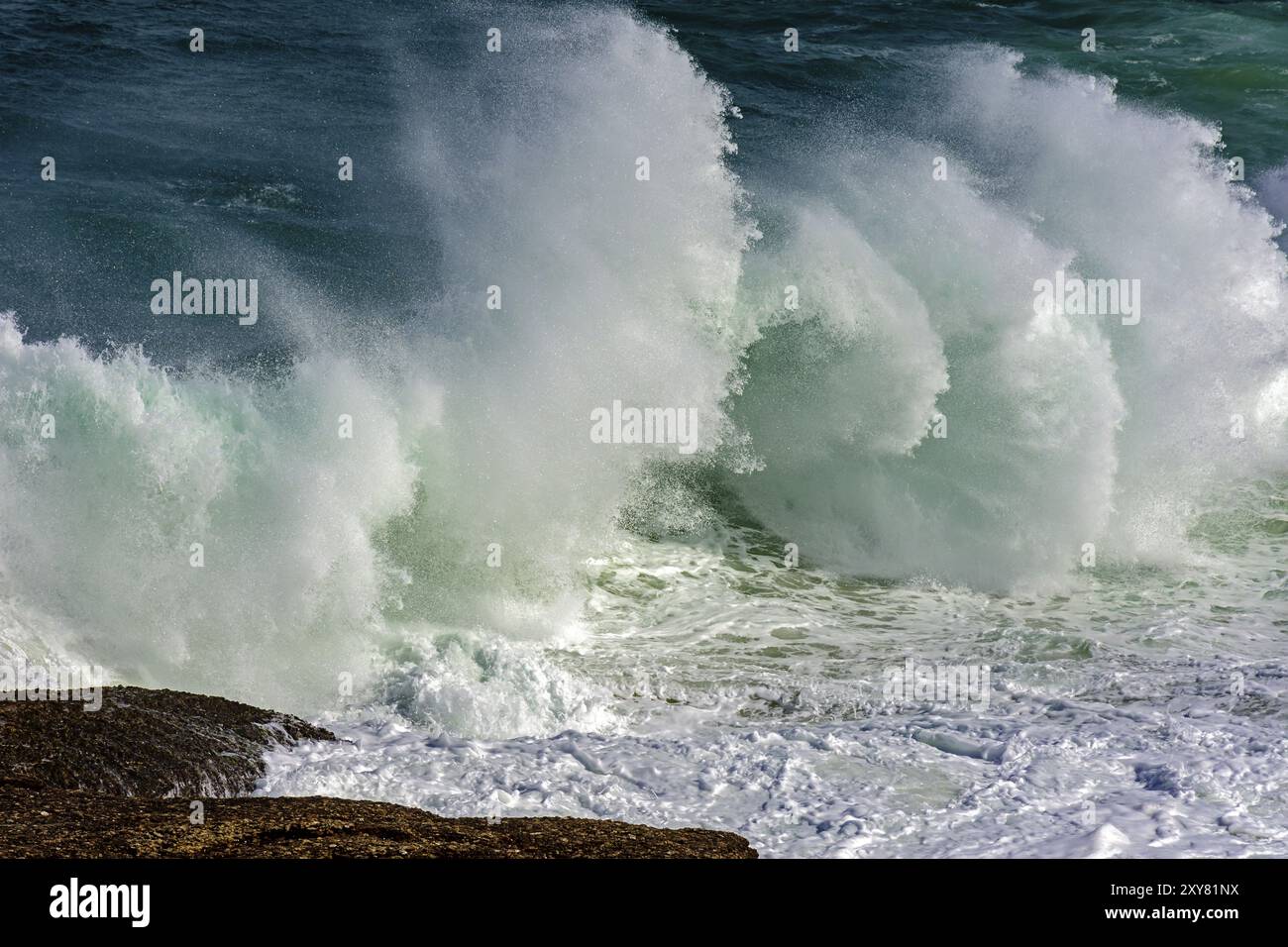 Storm surge wave over rocks hi-res stock photography and images - Alamy