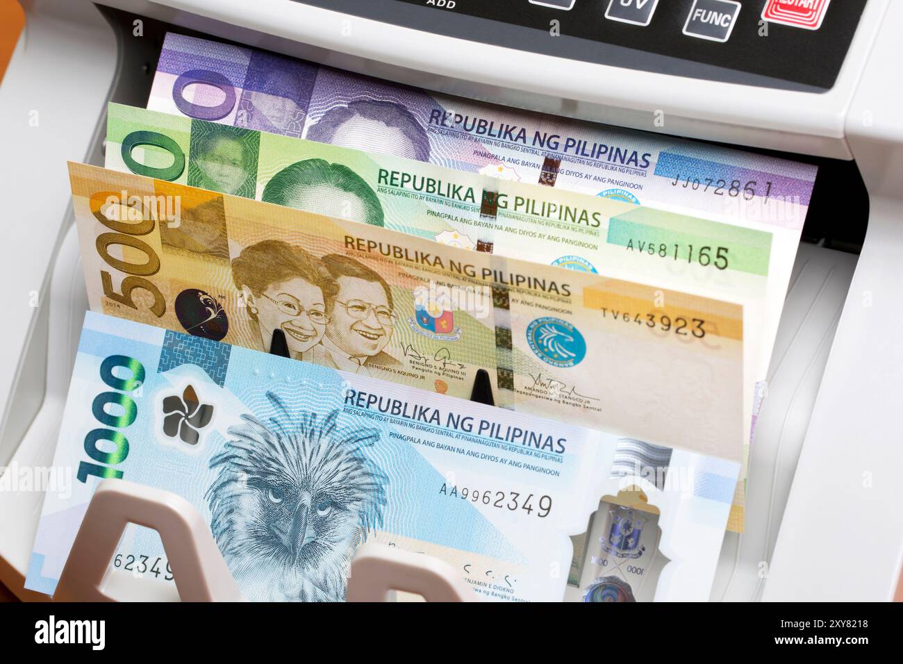 Philippine money - peso in the counting machine Stock Photo - Alamy