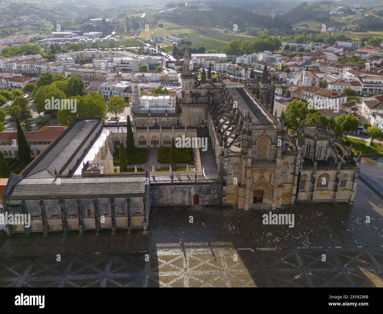 Aerial view of a historic monastery in Gothic architecture, surrounded ...