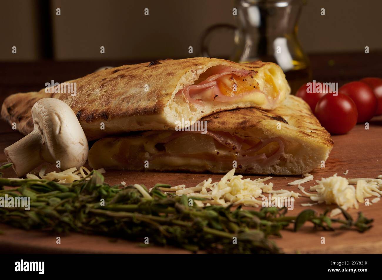 Calzone, traditional Italian preparation accompanied by spices and red ...