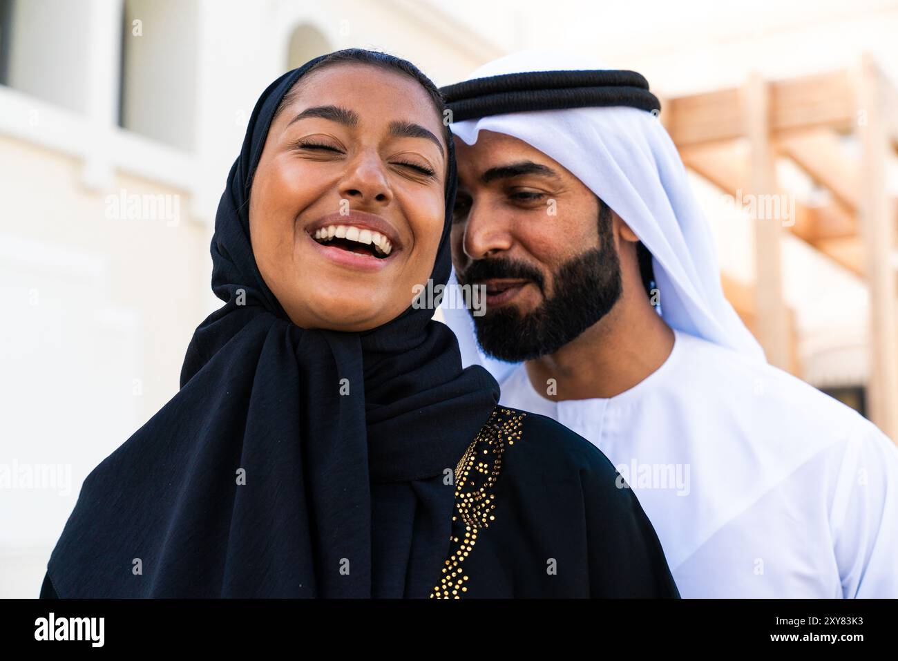 Traditional arab couple wearing emirati clothing dating outdoors - Middle-eastern married woman ...