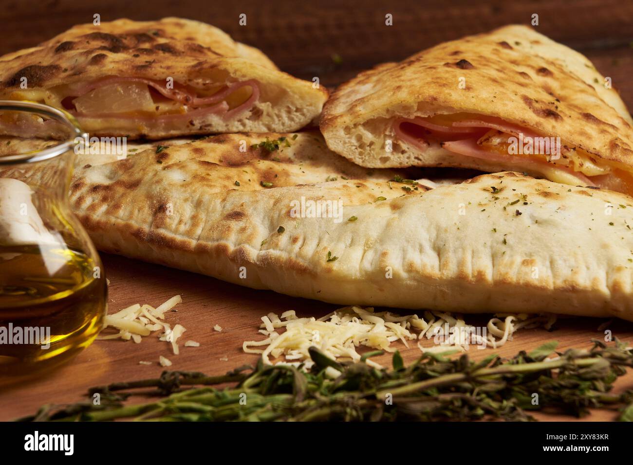 Calzone, traditional Italian preparation accompanied by spices and red ...