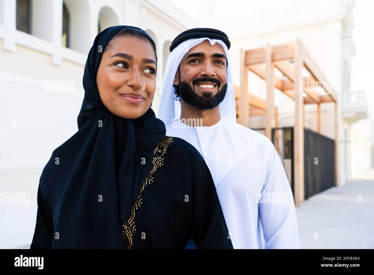 Traditional arab couple wearing emirati clothing dating outdoors - Middle-eastern married woman ...