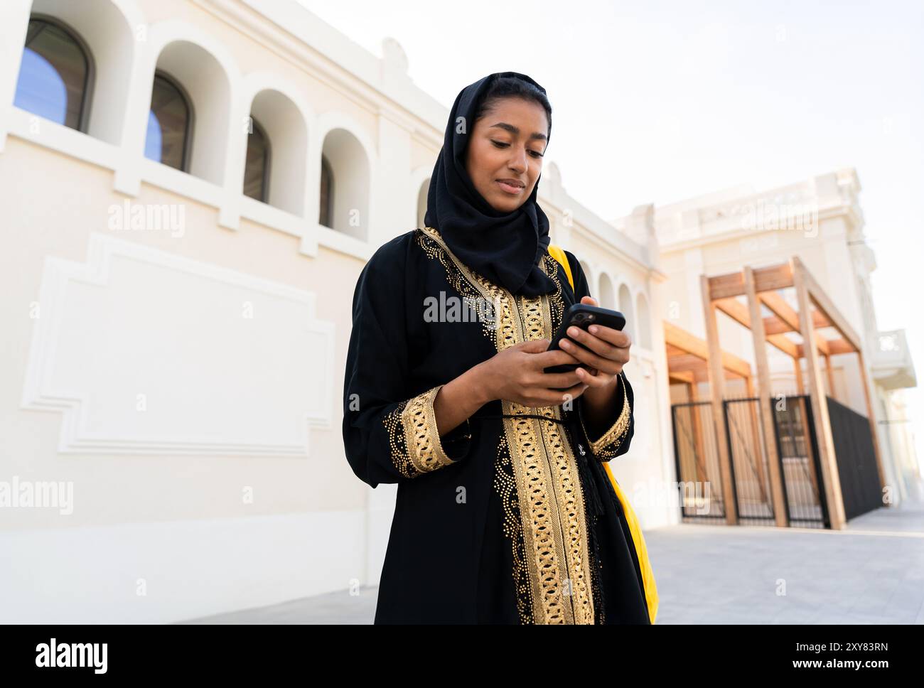 Traditional arab woman wearing emirati abaya outdoors - Beautiful ...