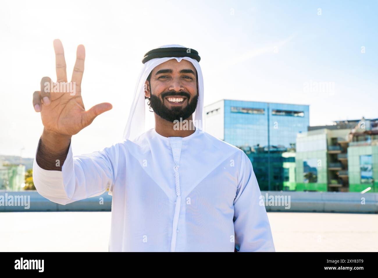 Traditional arab man wearing emirati kandura outdoors - Handsome middle ...