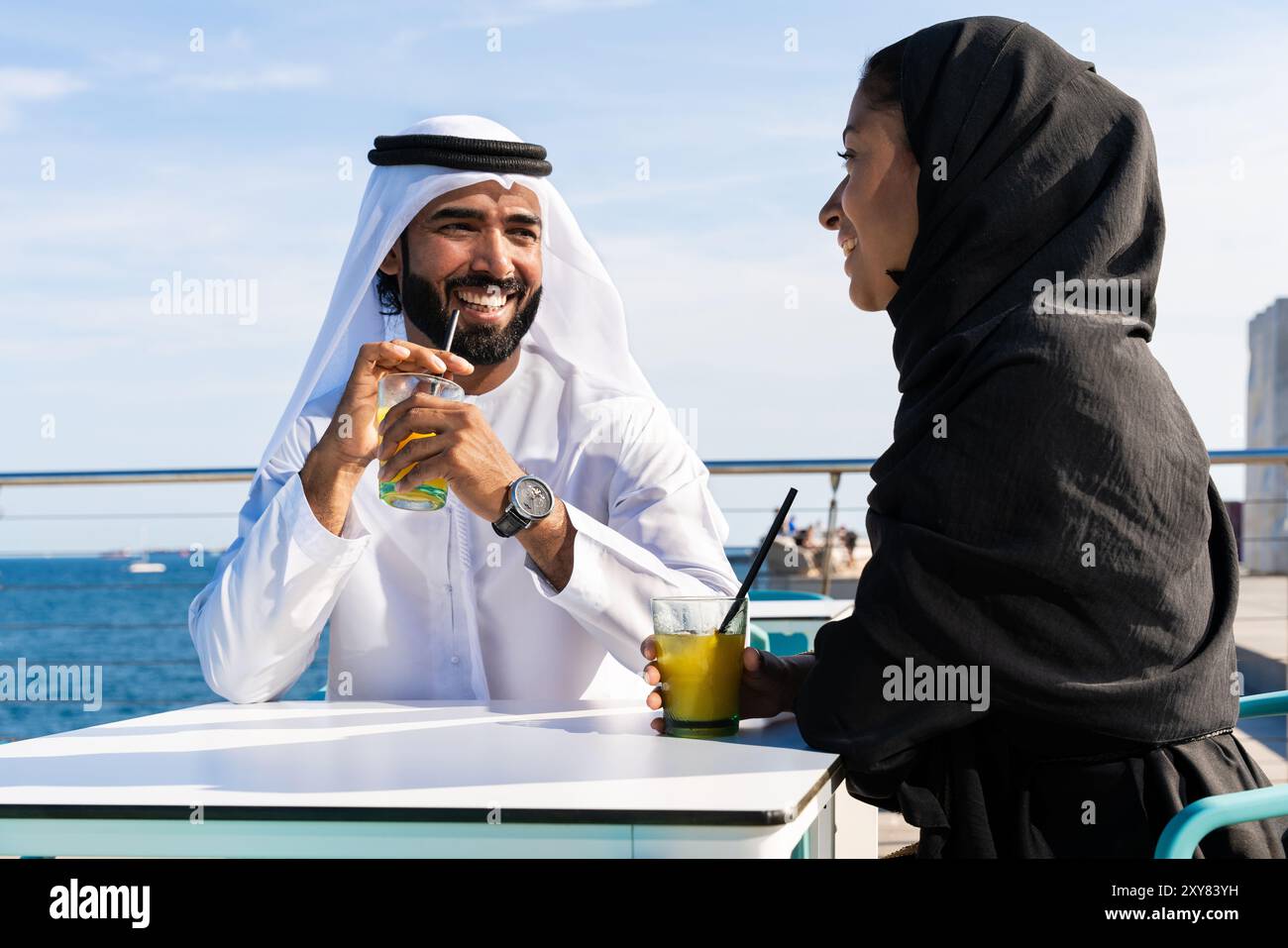Traditional arab couple wearing emirati clothing dating outdoors - Middle-eastern married woman ...
