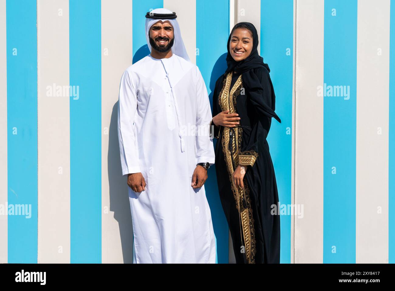 Traditional arab couple wearing emirati clothing dating outdoors - Middle-eastern married woman ...