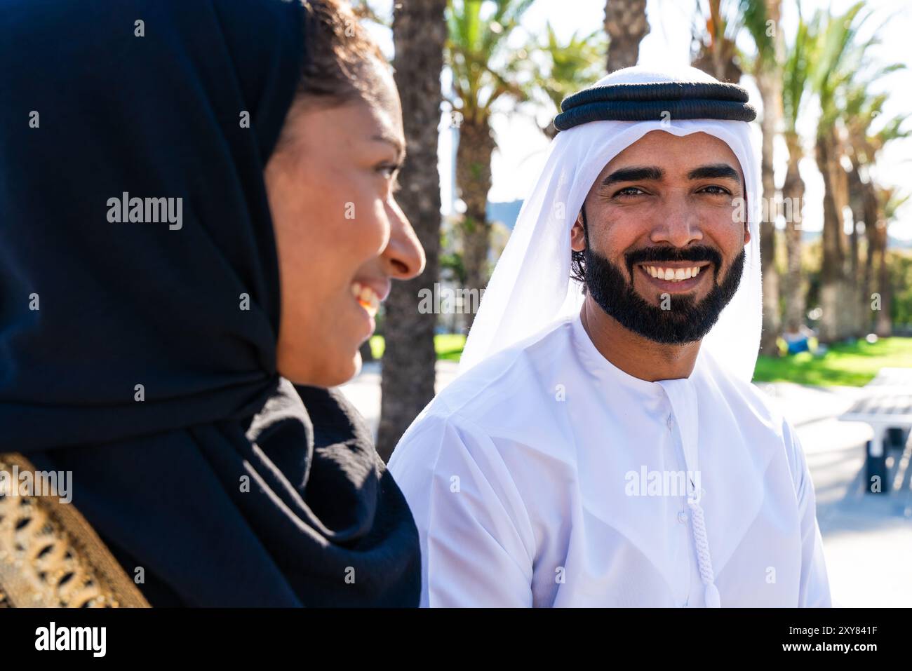 Traditional arab couple wearing emirati clothing dating outdoors - Middle-eastern married woman ...