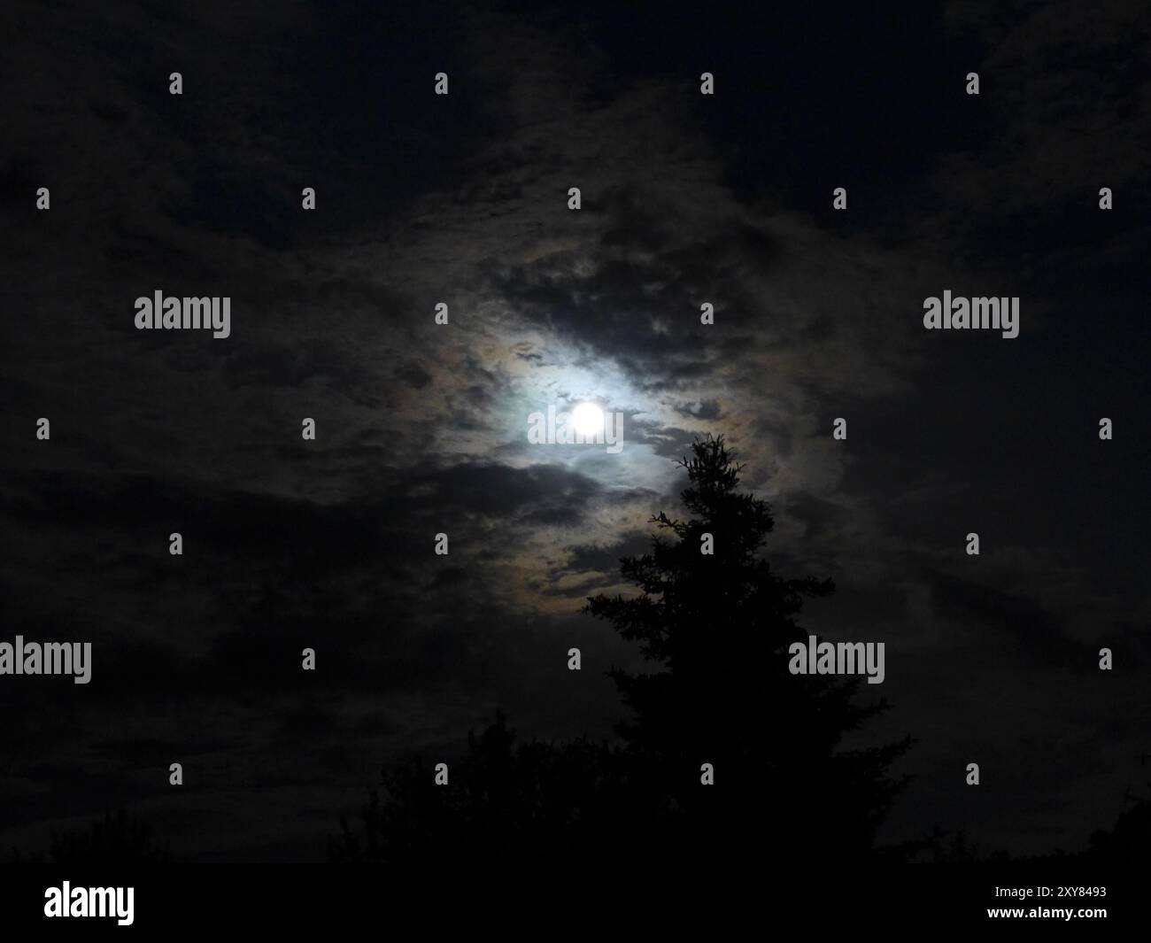Moon hidden by clouds hi-res stock photography and images - Alamy