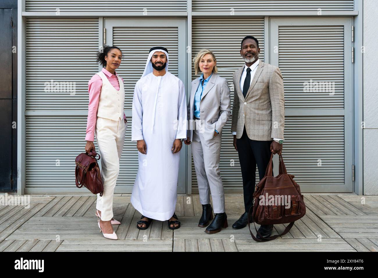 Group of multiethnic business people meeting an emirati businessman ...