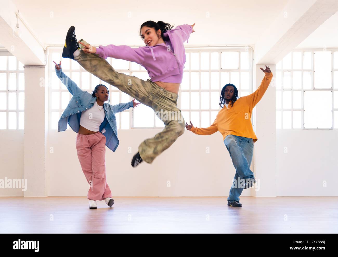 Young group of multiethnic hip-hop dancers wearing colorful urban ...