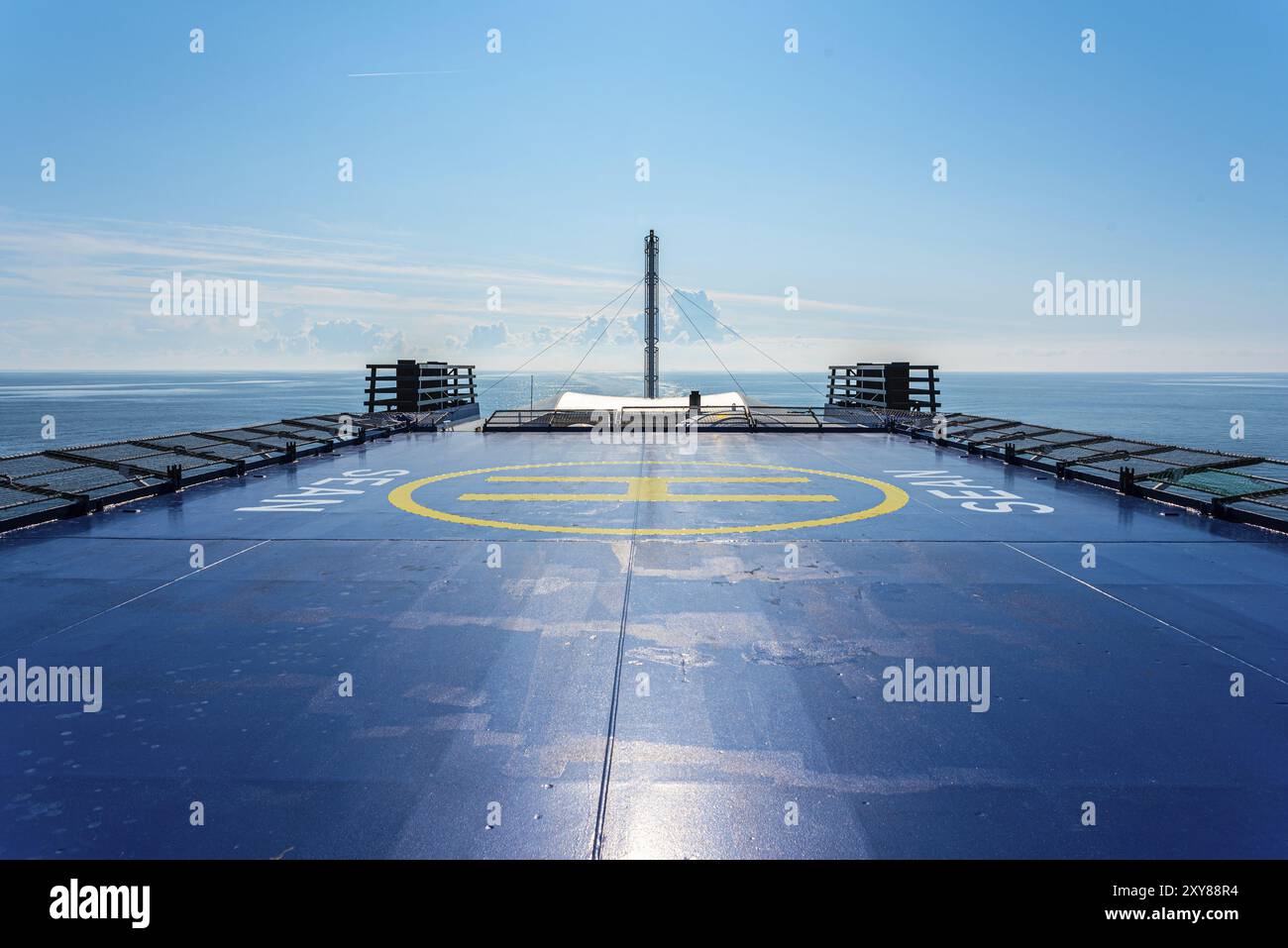 Helideck on top of a ferry at sea. Blue with yellow markings Stock ...