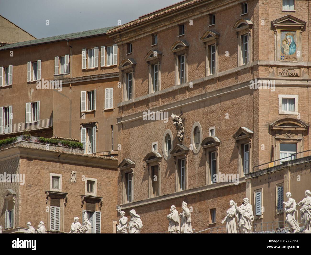 Historic buildings with statues in classical style and beige colours ...