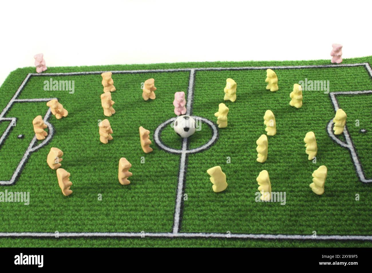 Gummy bears playing football in front of a white background Stock Photo ...