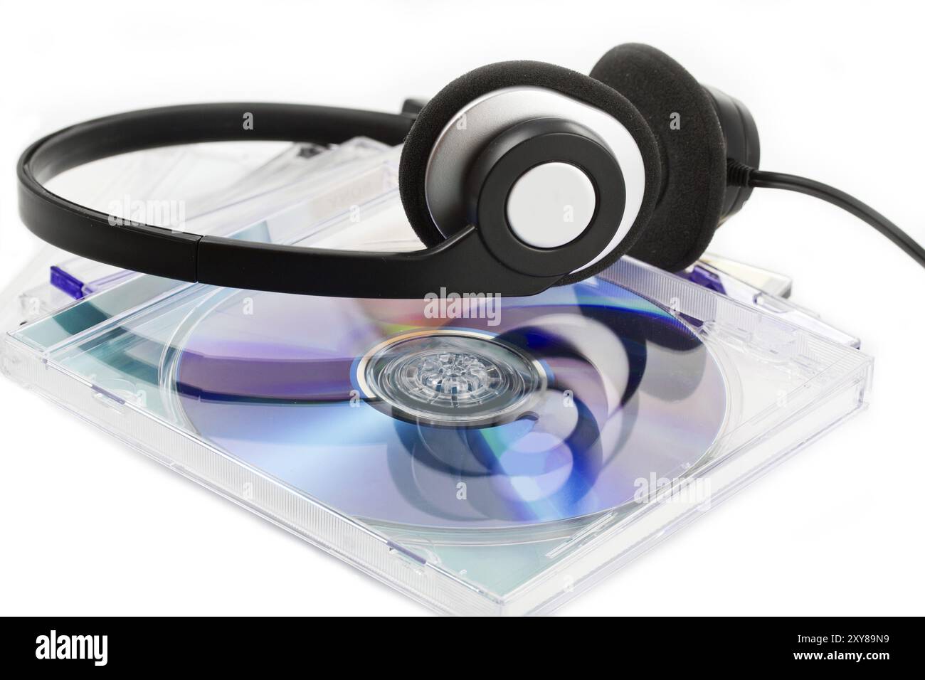 Compact Discs (CDs) with headphones on white Stock Photo - Alamy