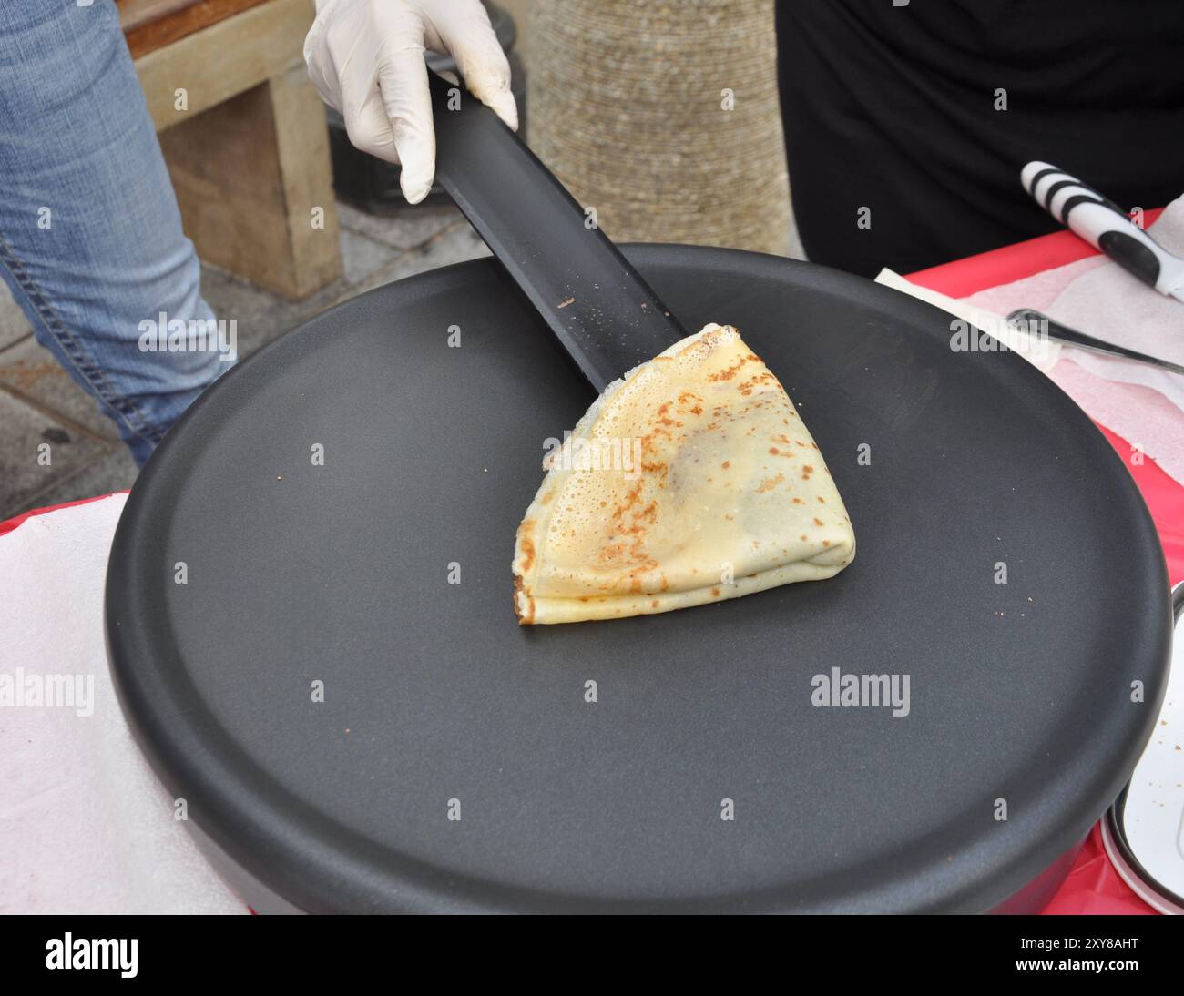 The cooking crepes chocolate and cookies with a crepe maker Stock Photo ...