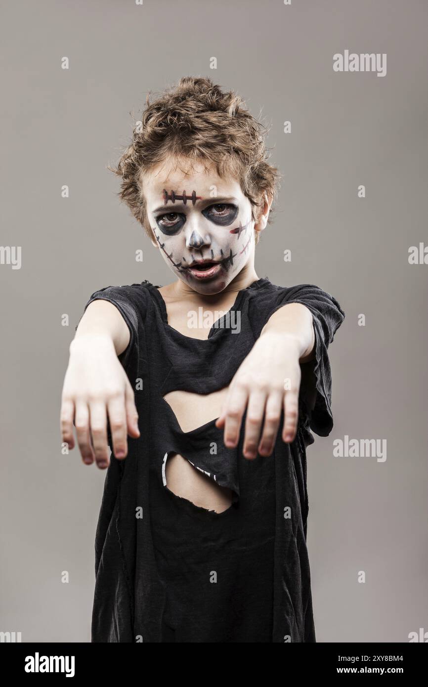 Halloween or horror concept, screaming walking dead zombie child boy ...