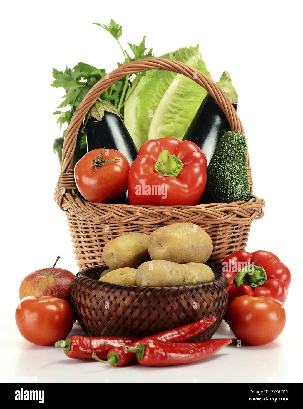 Composition with variety of fresh vegetables and wicker basket isolated ...