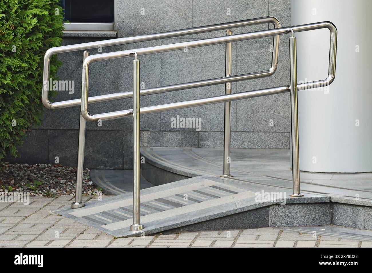 Ramp for wheelchair entry with metal handrails Stock Photo - Alamy