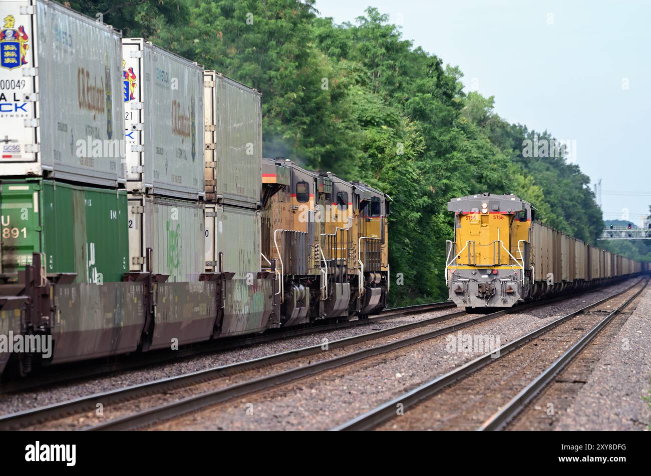 Glen Ellyn, Illinois, USA. Multiple locomotives lead an eastbound Union Pacific intermodal ...