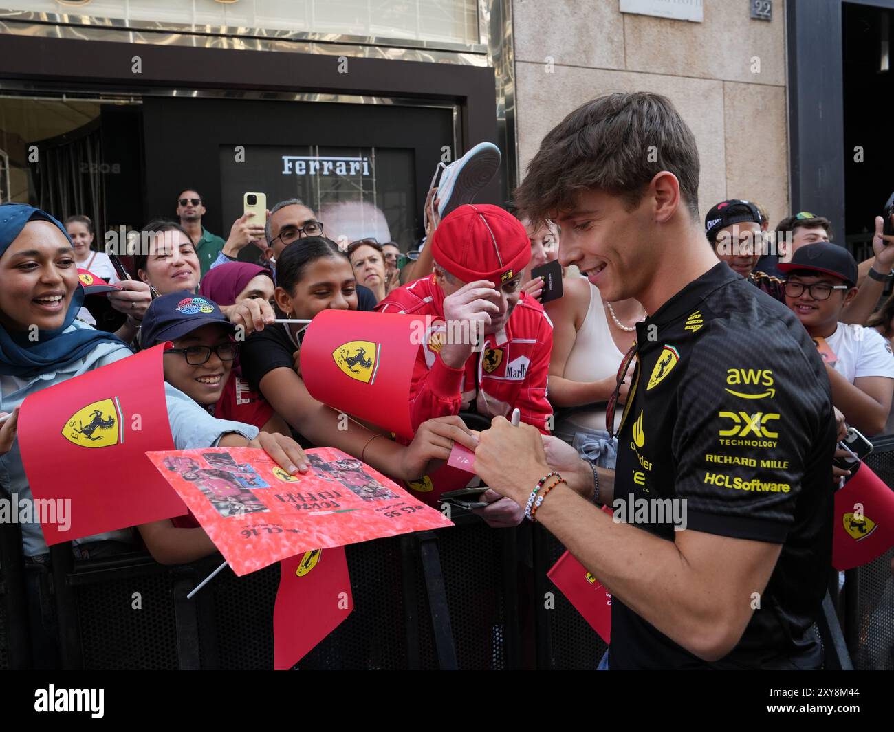 Milan - Ferrari fans storm the arrival of drivers Charles Leclerc and ...