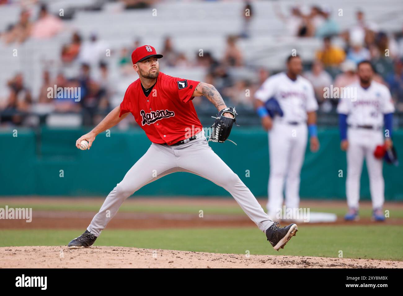 Birmingham Barons relief pitcher Jordan Mikel (24) in action against ...