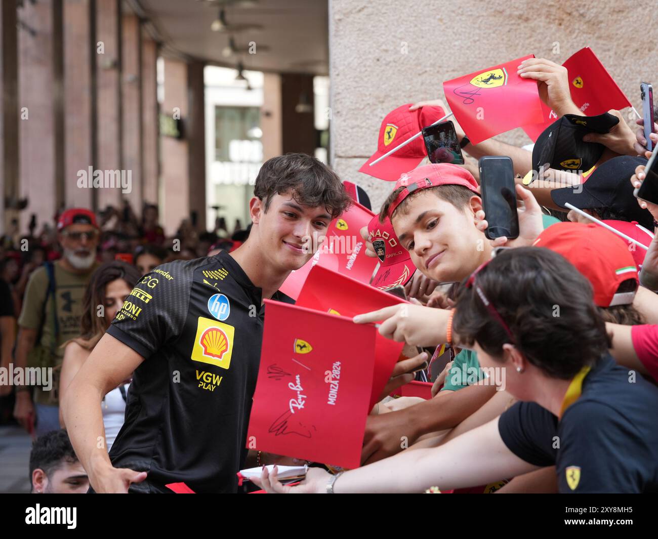 Milan - Ferrari fans storm the arrival of drivers Charles Leclerc and ...