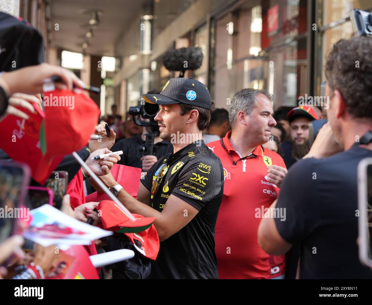 Milan - Ferrari fans storm the arrival of drivers Charles Leclerc and ...