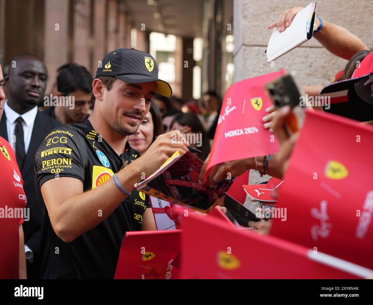 Milan - Ferrari fans storm the arrival of drivers Charles Leclerc and ...