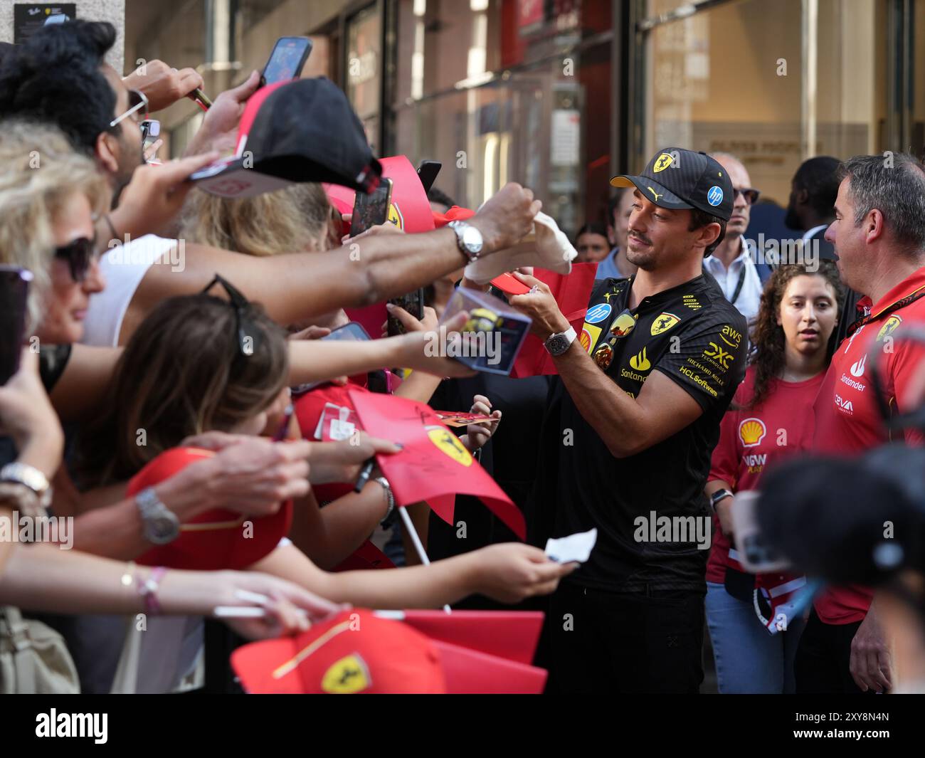 Milan - Ferrari fans storm the arrival of drivers Charles Leclerc and ...
