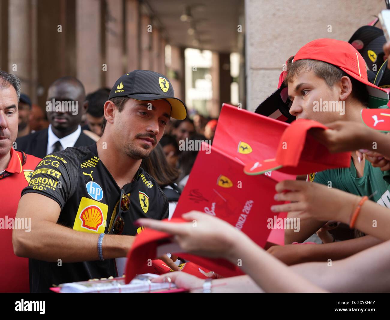 Milan - Ferrari fans storm the arrival of drivers Charles Leclerc and ...