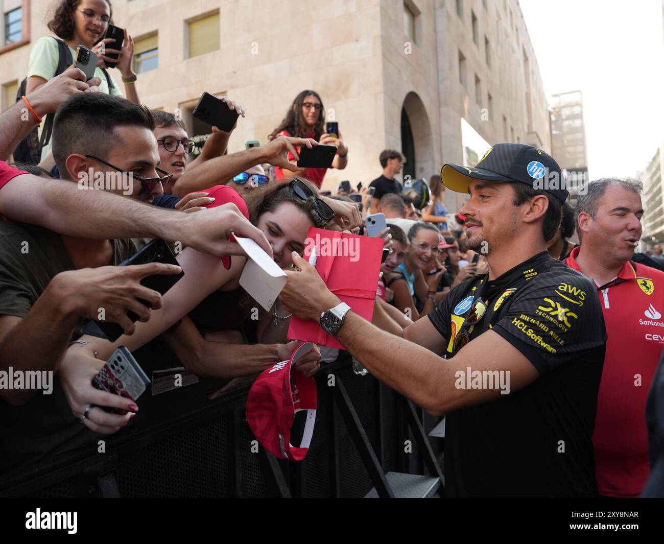 Milan - Ferrari fans storm the arrival of drivers Charles Leclerc and ...