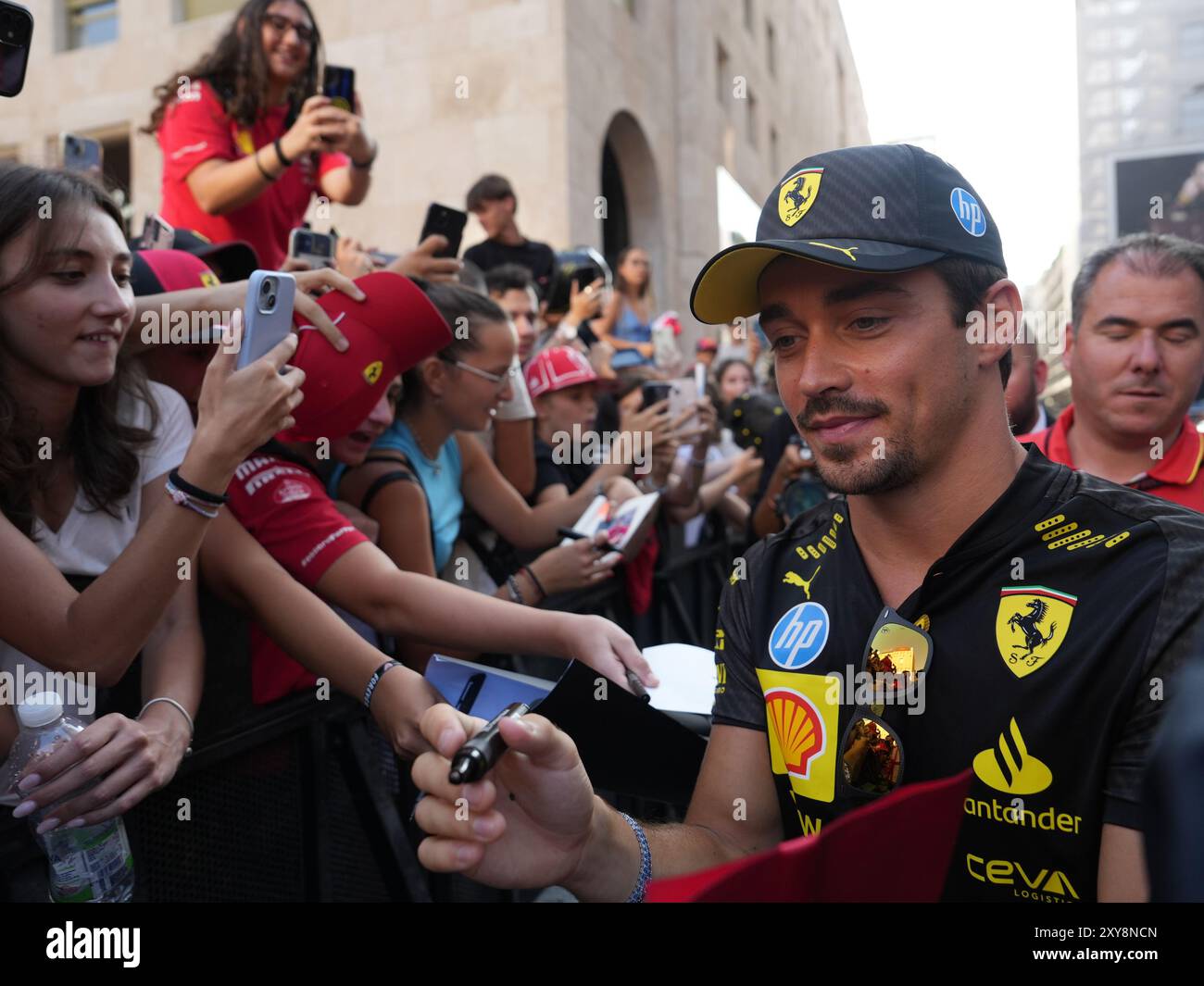 Milan - Ferrari fans storm the arrival of drivers Charles Leclerc and ...