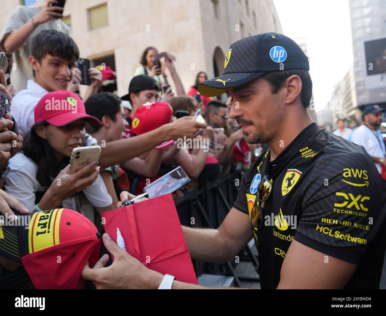 Milan - Ferrari fans storm the arrival of drivers Charles Leclerc and ...
