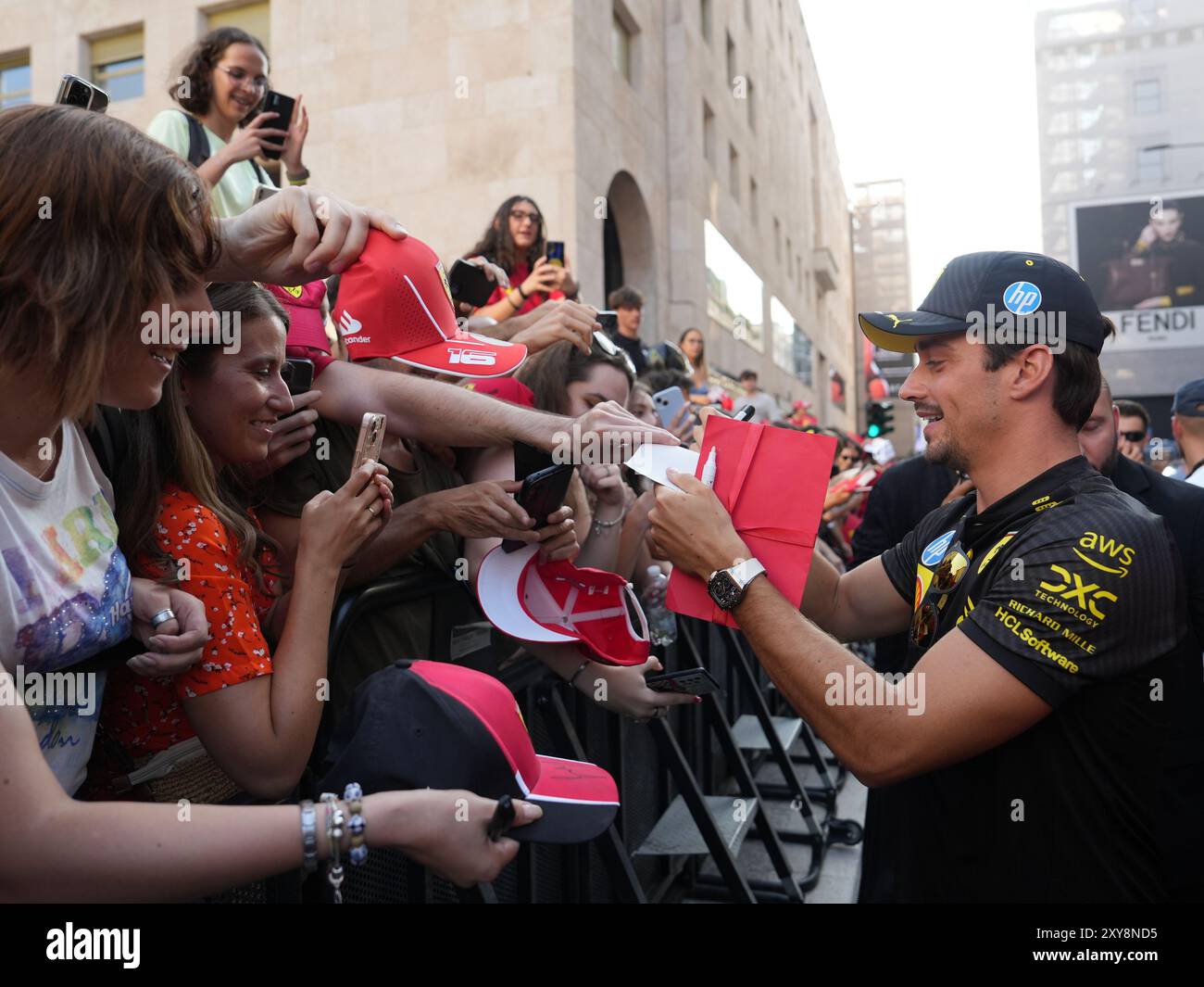 Milan - Ferrari fans storm the arrival of drivers Charles Leclerc and ...