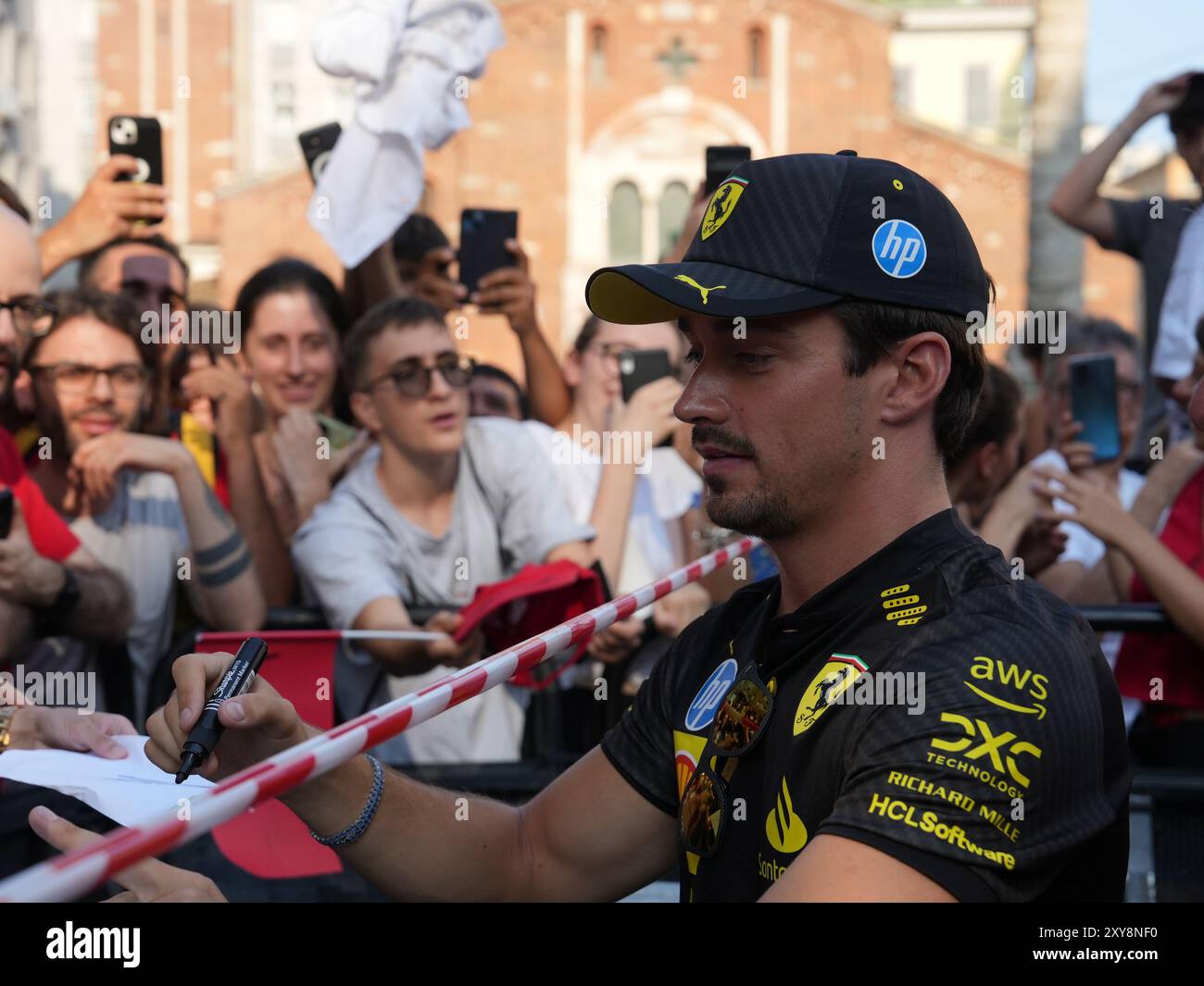 Milan - Ferrari fans storm the arrival of drivers Charles Leclerc and ...