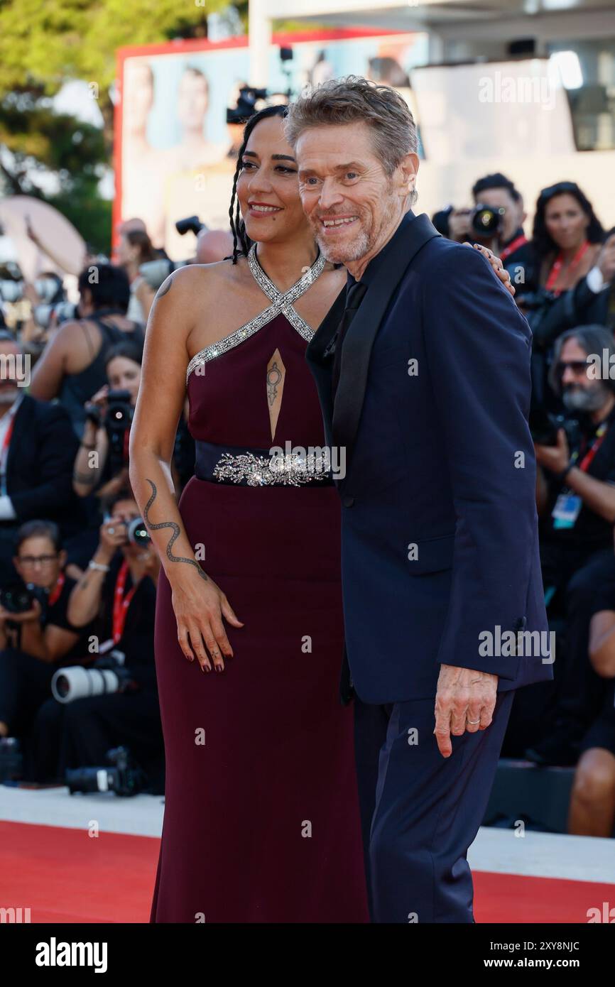 Giada Colagrande, left, and Willem Dafoe pose for photographers upon arrival for the premiere of ...
