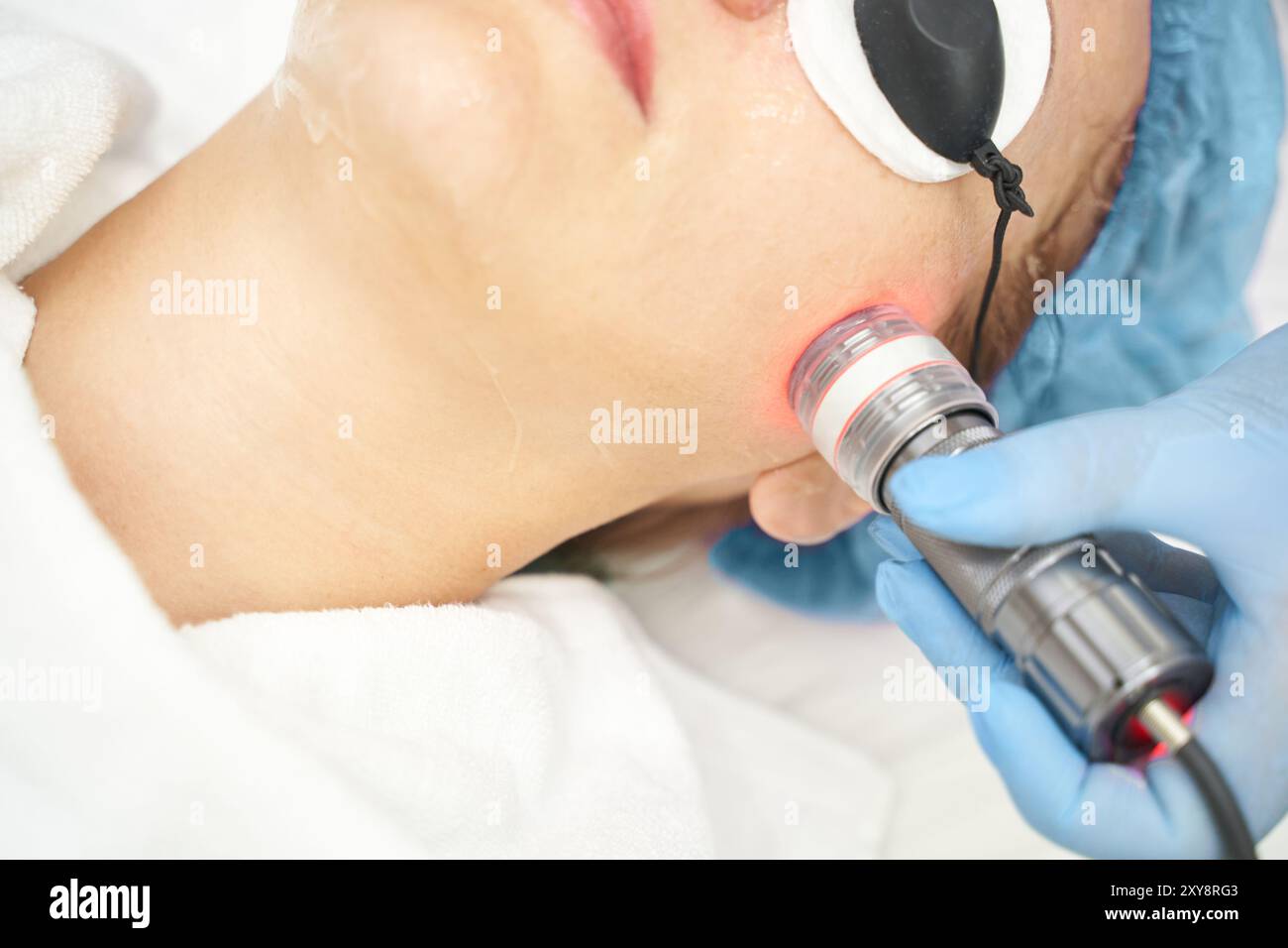 Light infrared therapy. Cosmetology head procedure. Beauty woman face ...