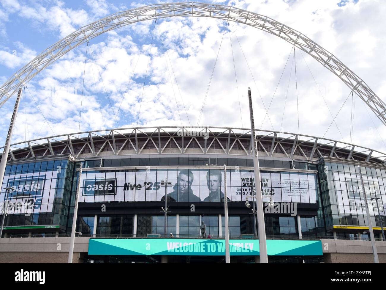 London, UK. 28th August 2024. Screens at Wembley Stadium advertise the ...
